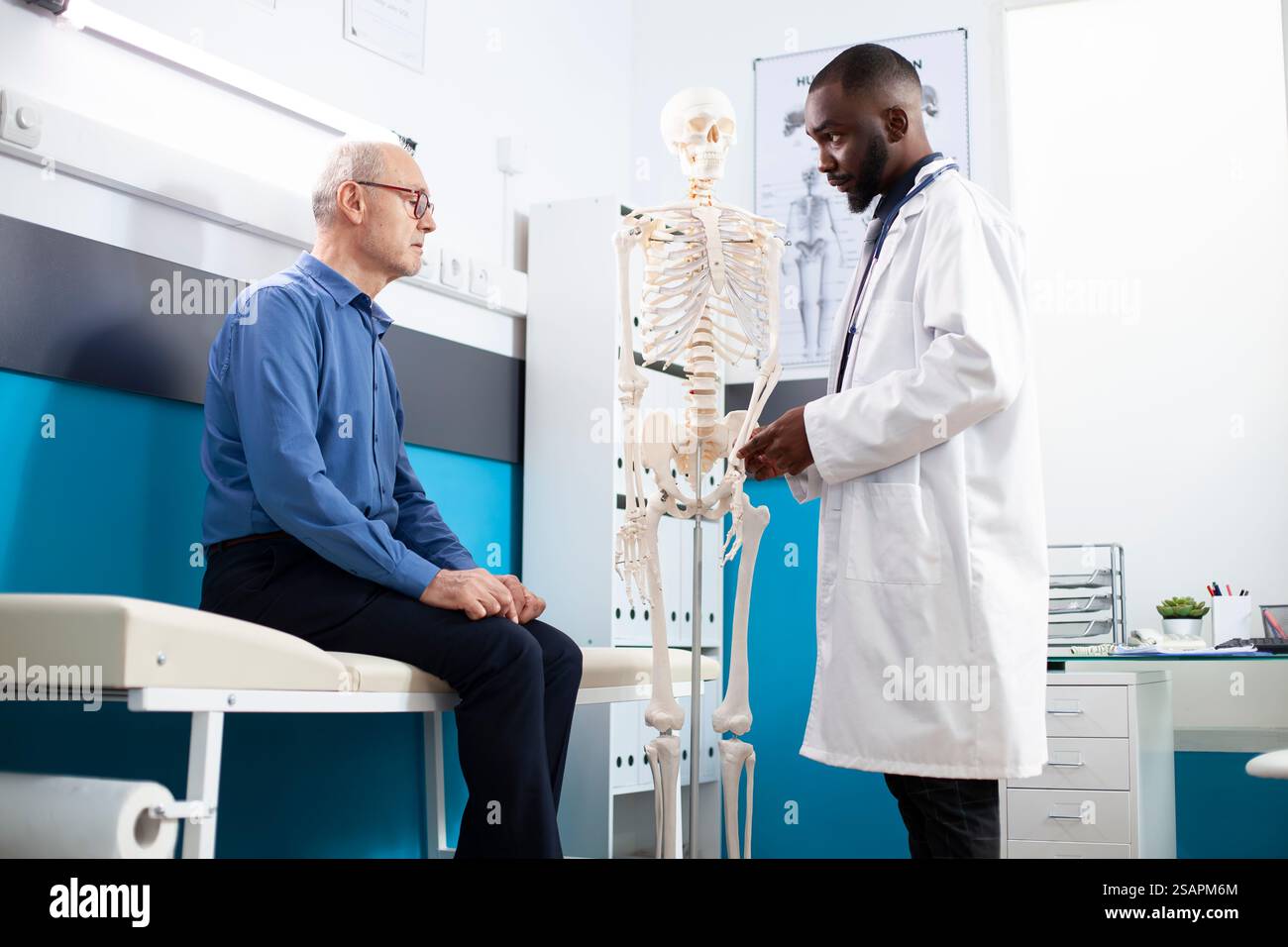 Caucasian senior man and african american doctor engage in orthopedic ...