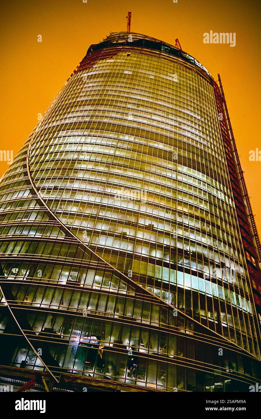 Low angle view of One Congress skyscraper under construction at night ...