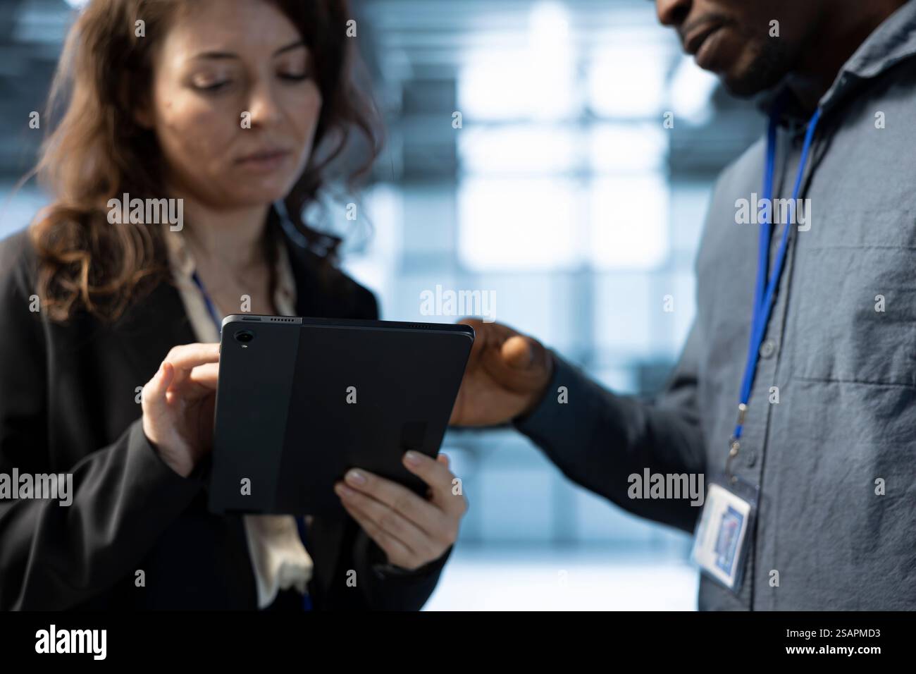 Admin And Coworker In Data Center Using Tablet Integrating Green Technologies Teamworking