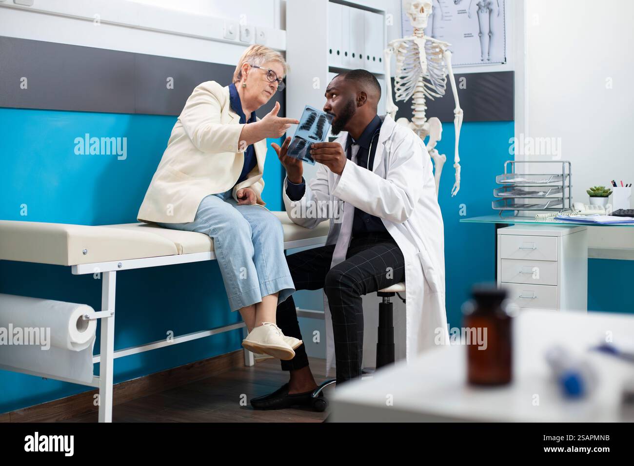 African american doctor explains hi-res stock photography and images ...