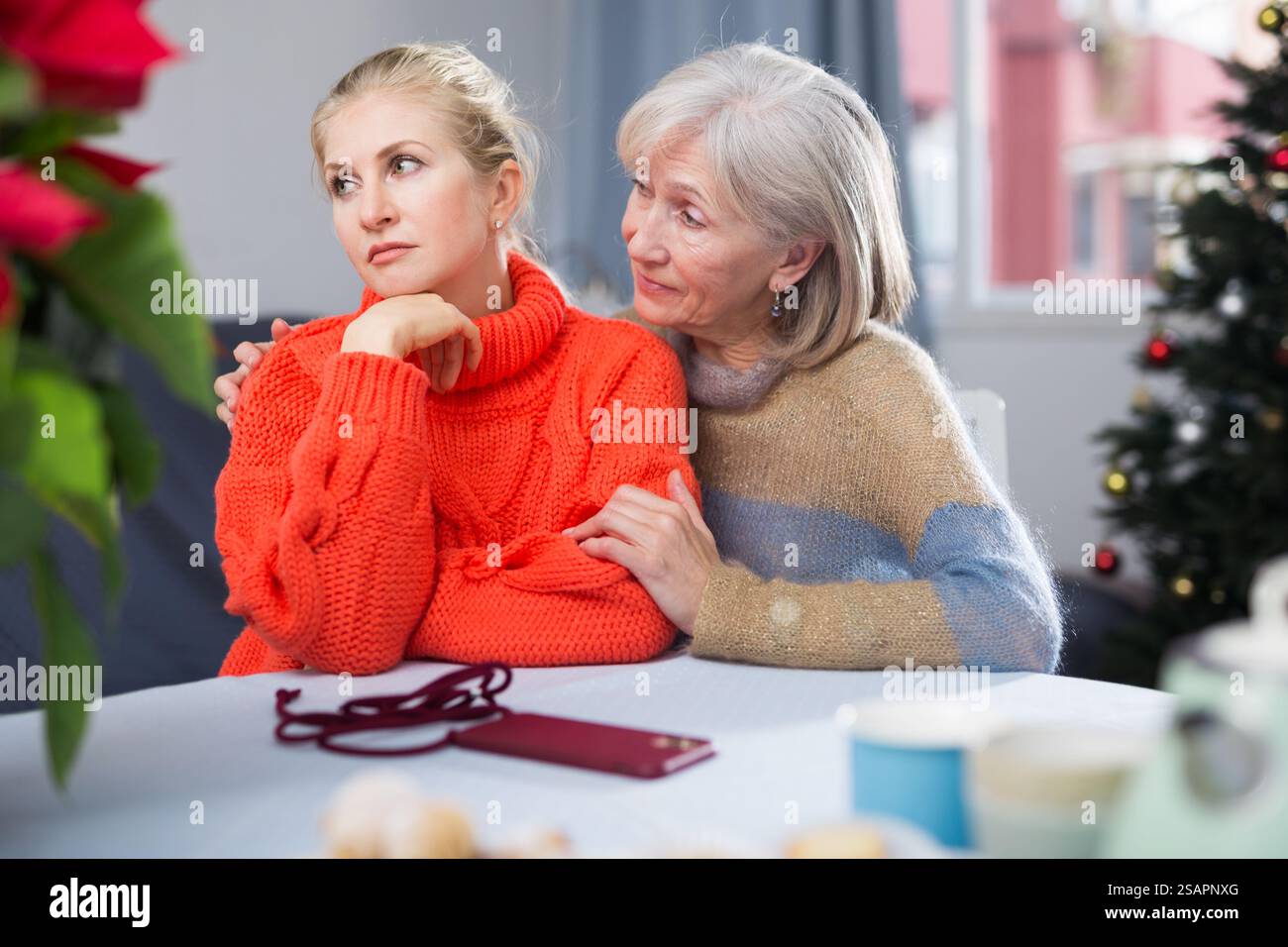 Home quarrel between mom and daughter during christmas closeup Stock ...