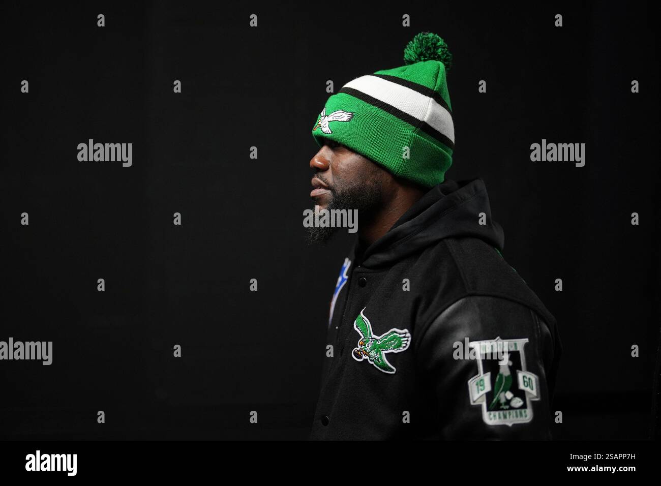 Entertainer Kevin Hart walks off the field before the NFC Championship ...