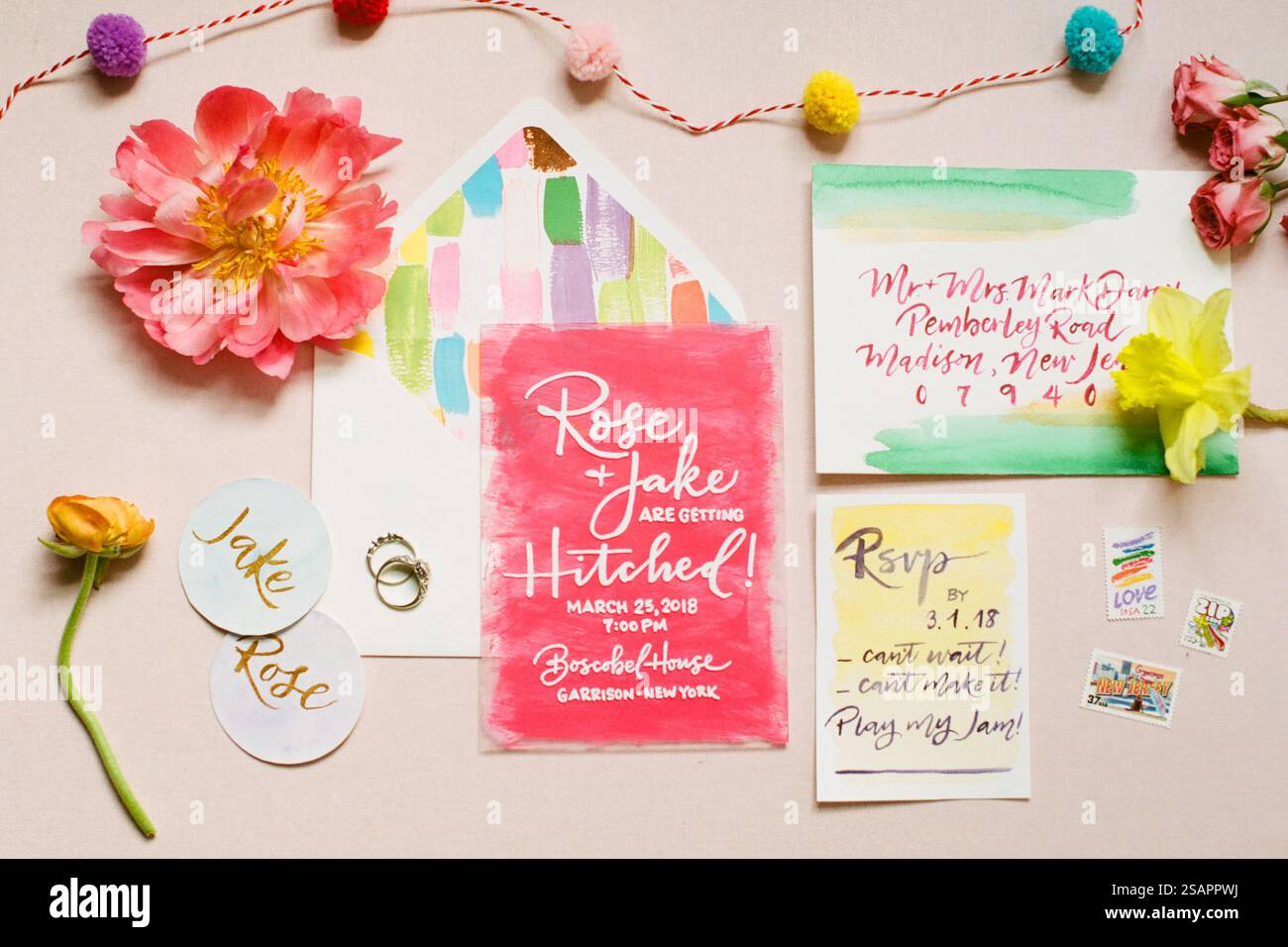 A vibrant wedding invitation arrangement showcases colorful designs ...