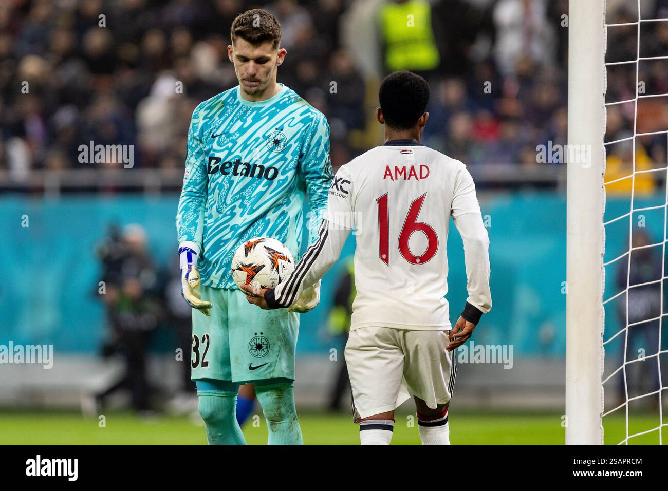 Amad Diallo of Manchester United giving the ball to Stefan Tarnovanu of ...