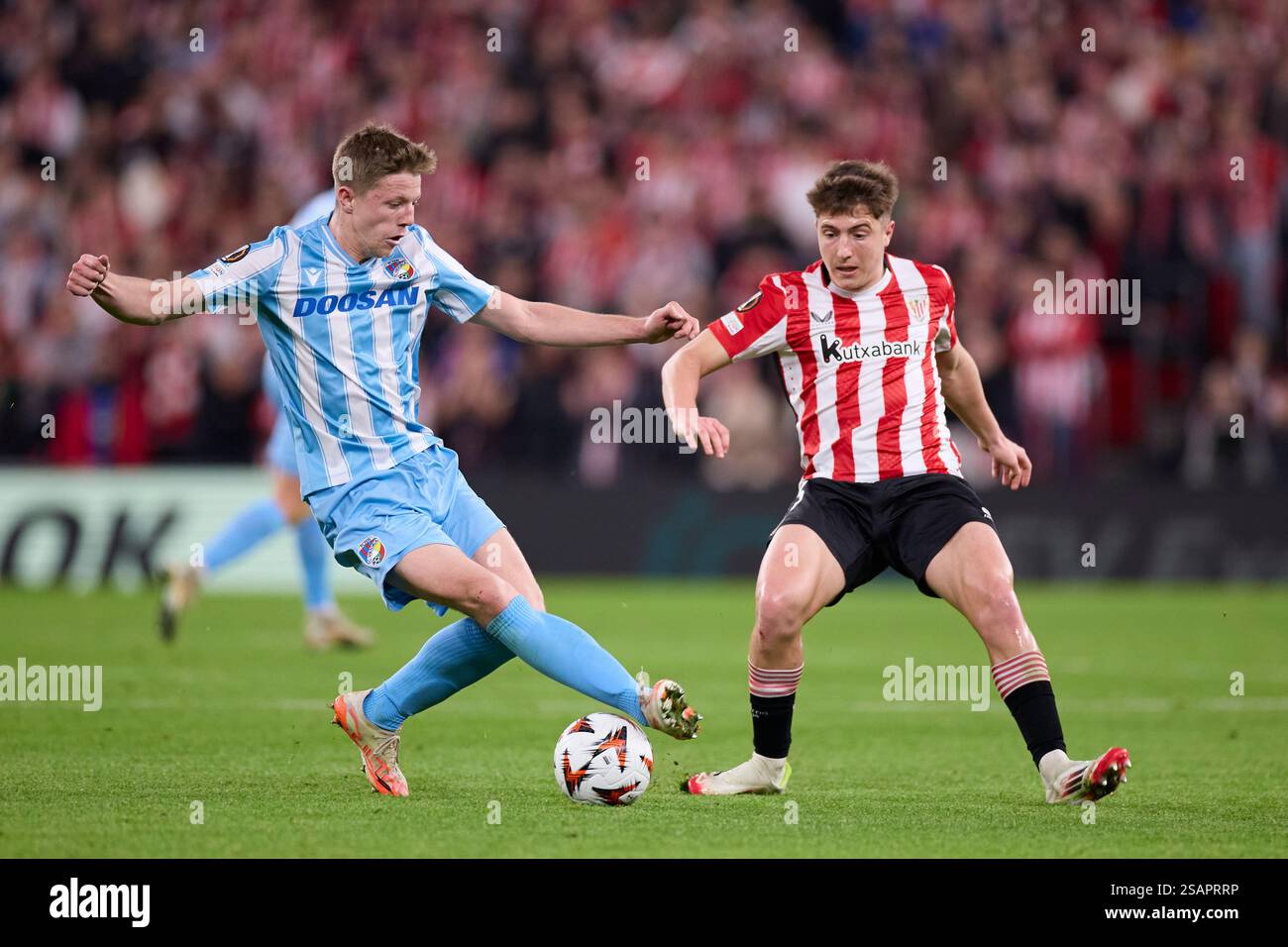 Lukas Cerv of FC Viktoria Plzen competes for the ball with Mikel ...