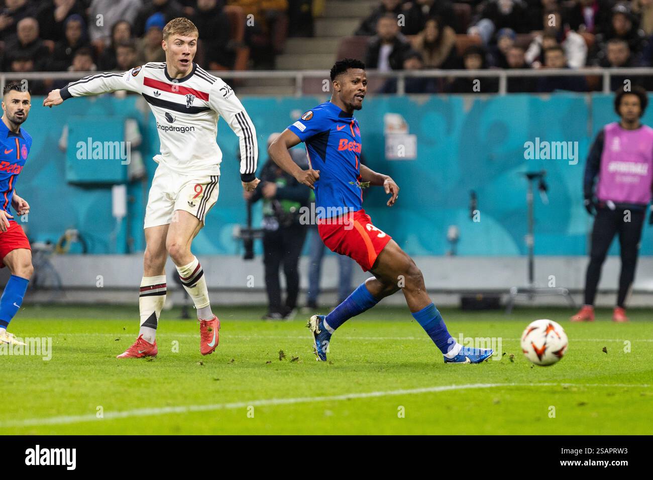 Rasmus Hojlund of Manchester United and Siyabonga Ngezana of FCSB in ...