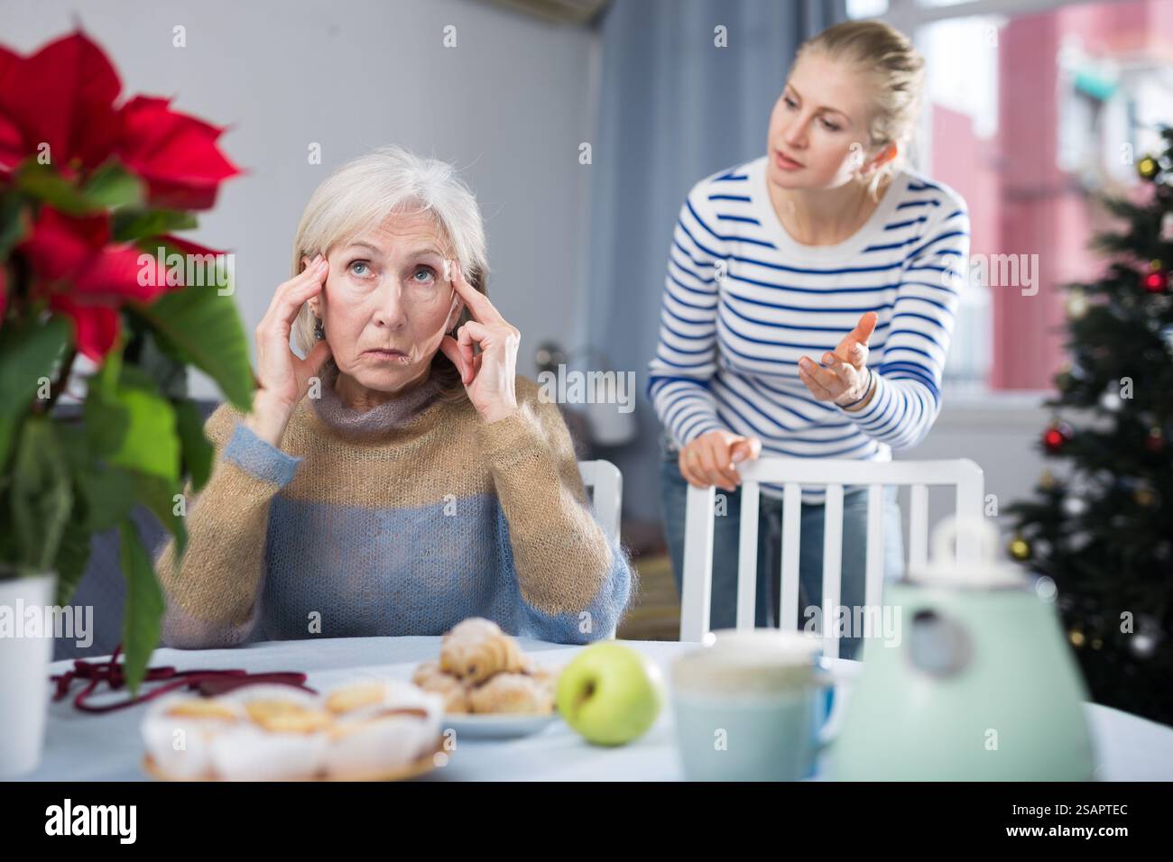 Adult daughter quarrels with her mature mother Stock Photo - Alamy