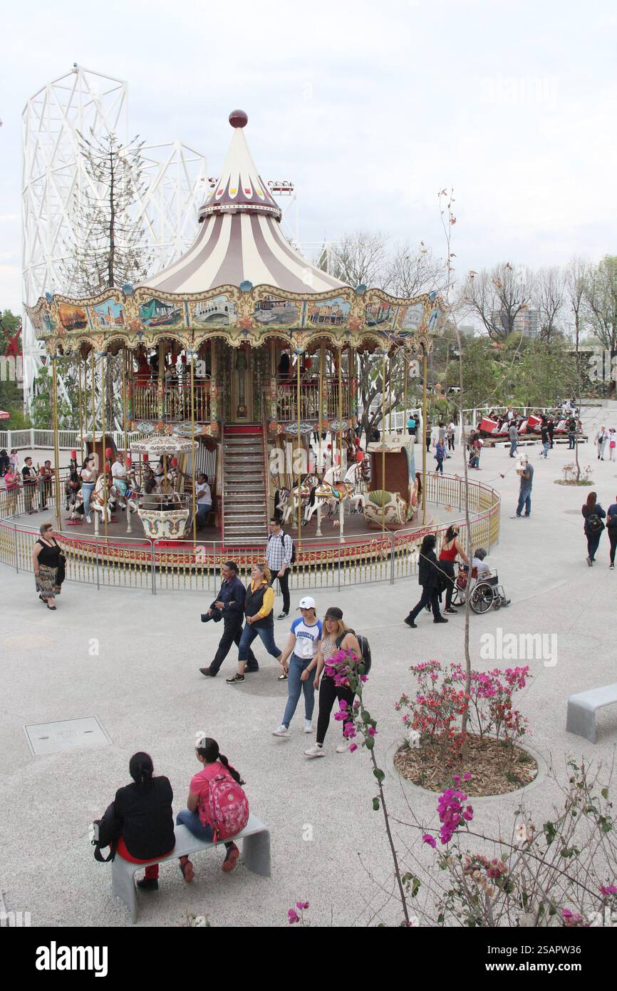 Mexico City, Mexico - Mar 20 2024: Two-story carousel with moving rides ...