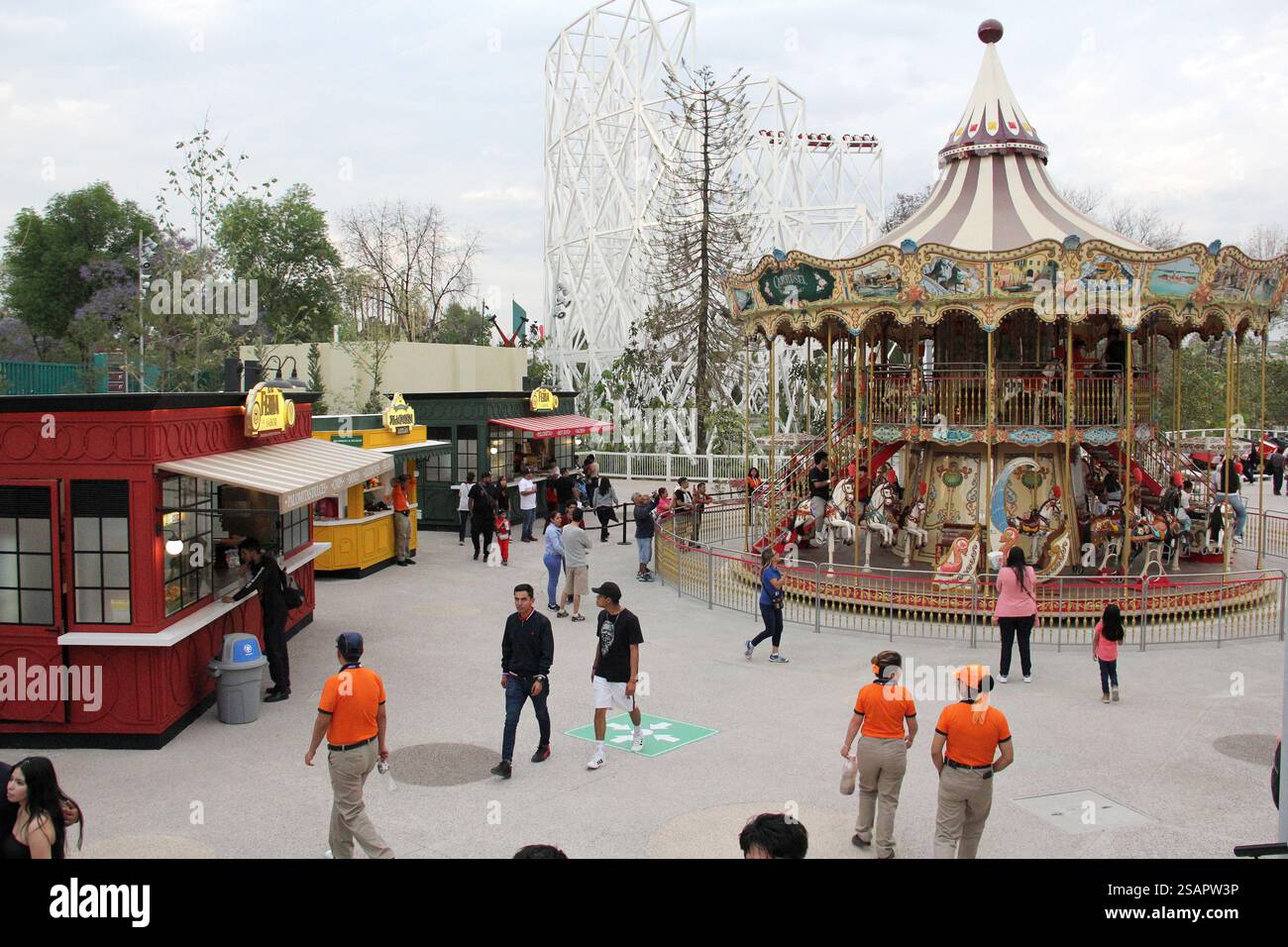 Mexico City, Mexico - Mar 20 2024: Two-story carousel with moving rides ...