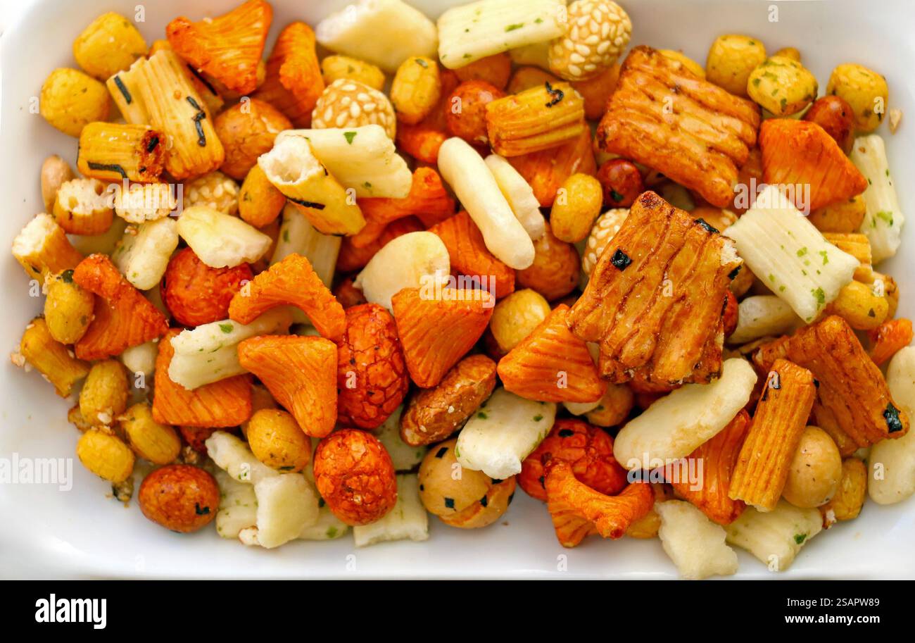 Pile of colorful rice crackers snacks in ceramic plate Stock Photo - Alamy