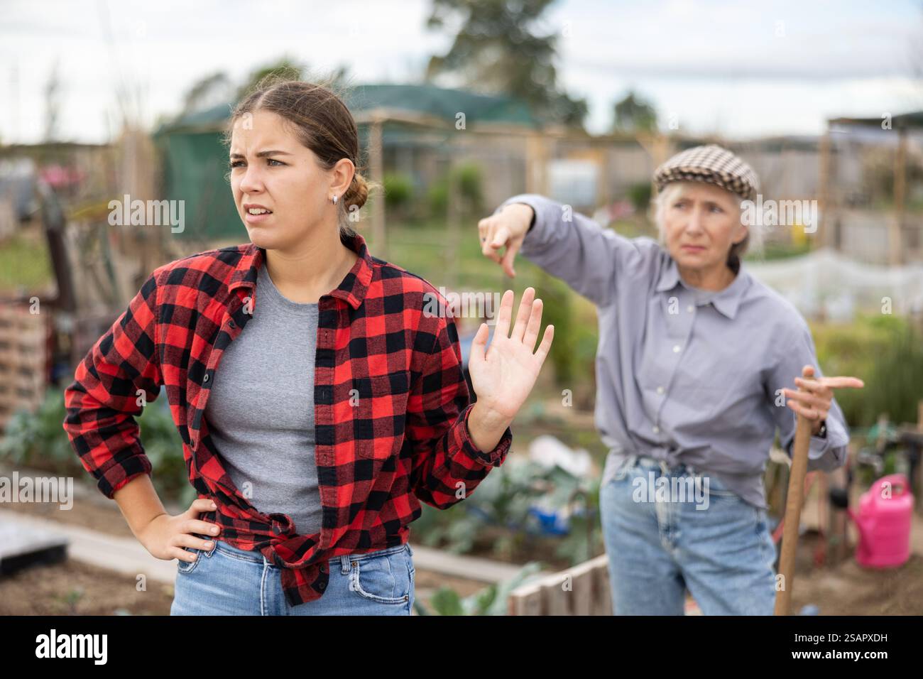 Conflict between female neighbors in country farm Stock Photo - Alamy