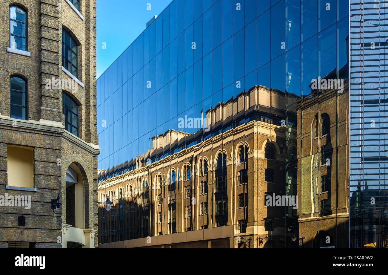 A modern glass building reflecting the historic architecture of an ...