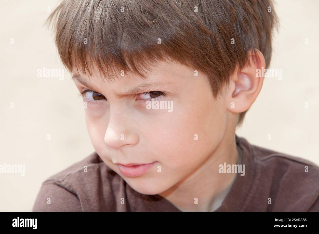 confused boy raising his eyebrow with funny face on white background ...