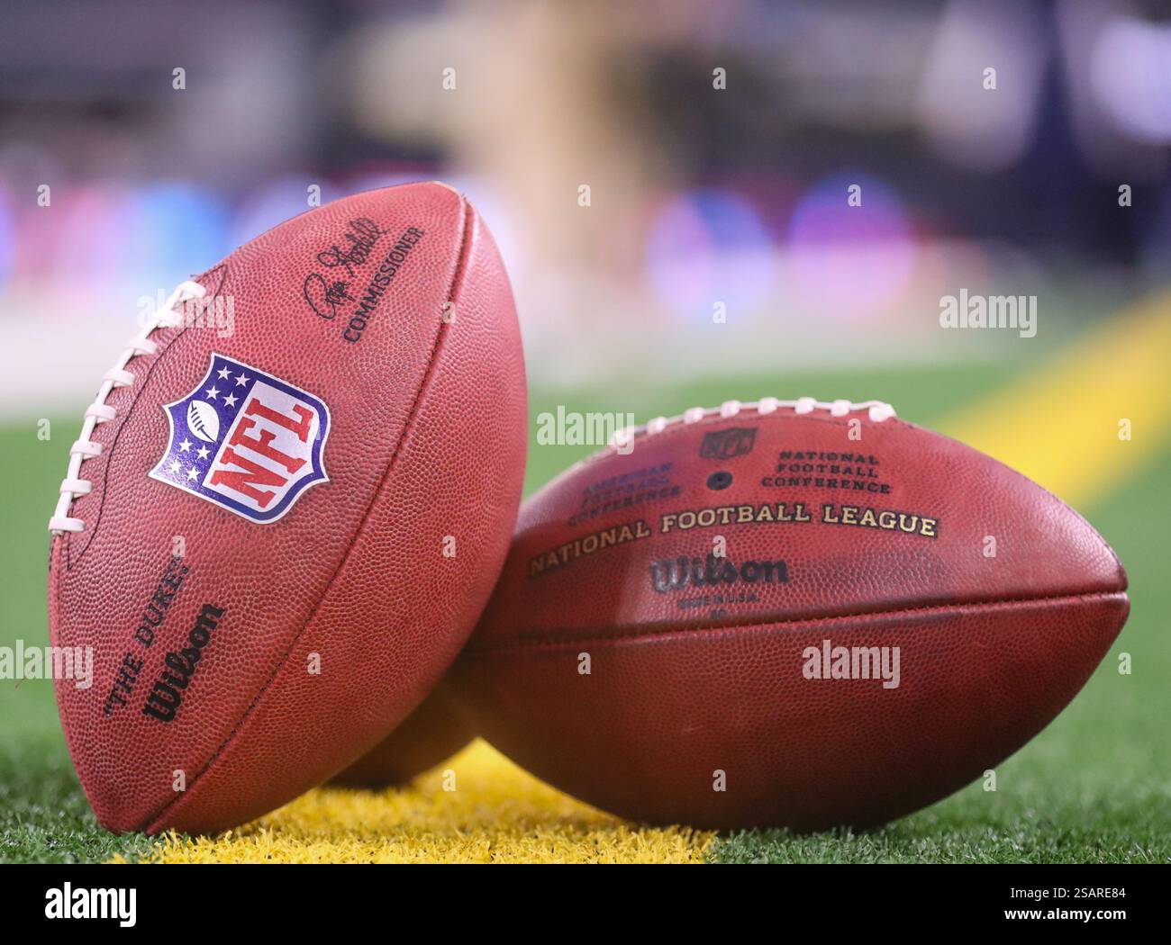 Arlington, Texas, USA. 30th Jan, 2025. NFL footballs sit on the turf of ...