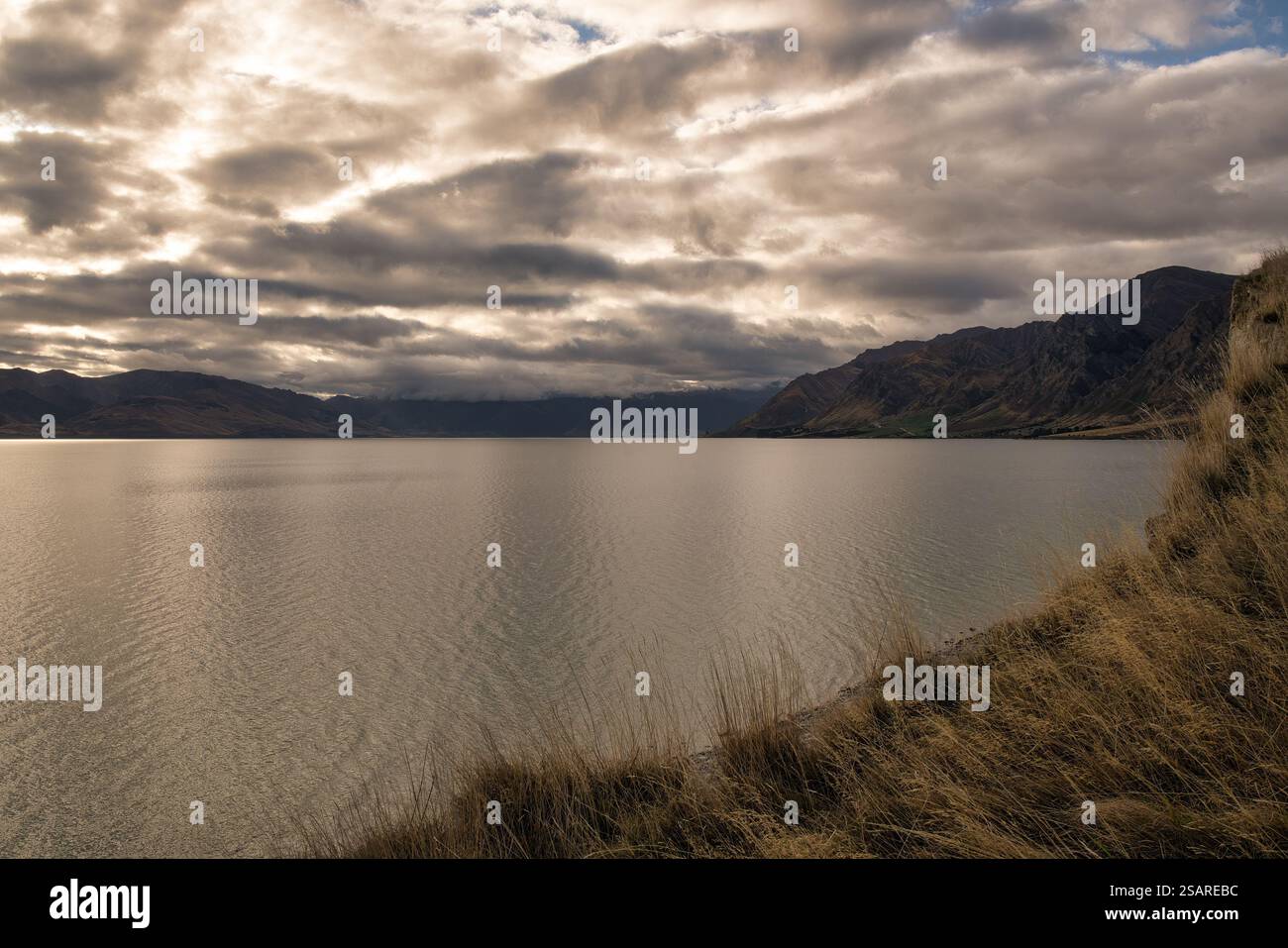 The mountains along both sides of Lake Hawea near Wanaka Stock Photo ...