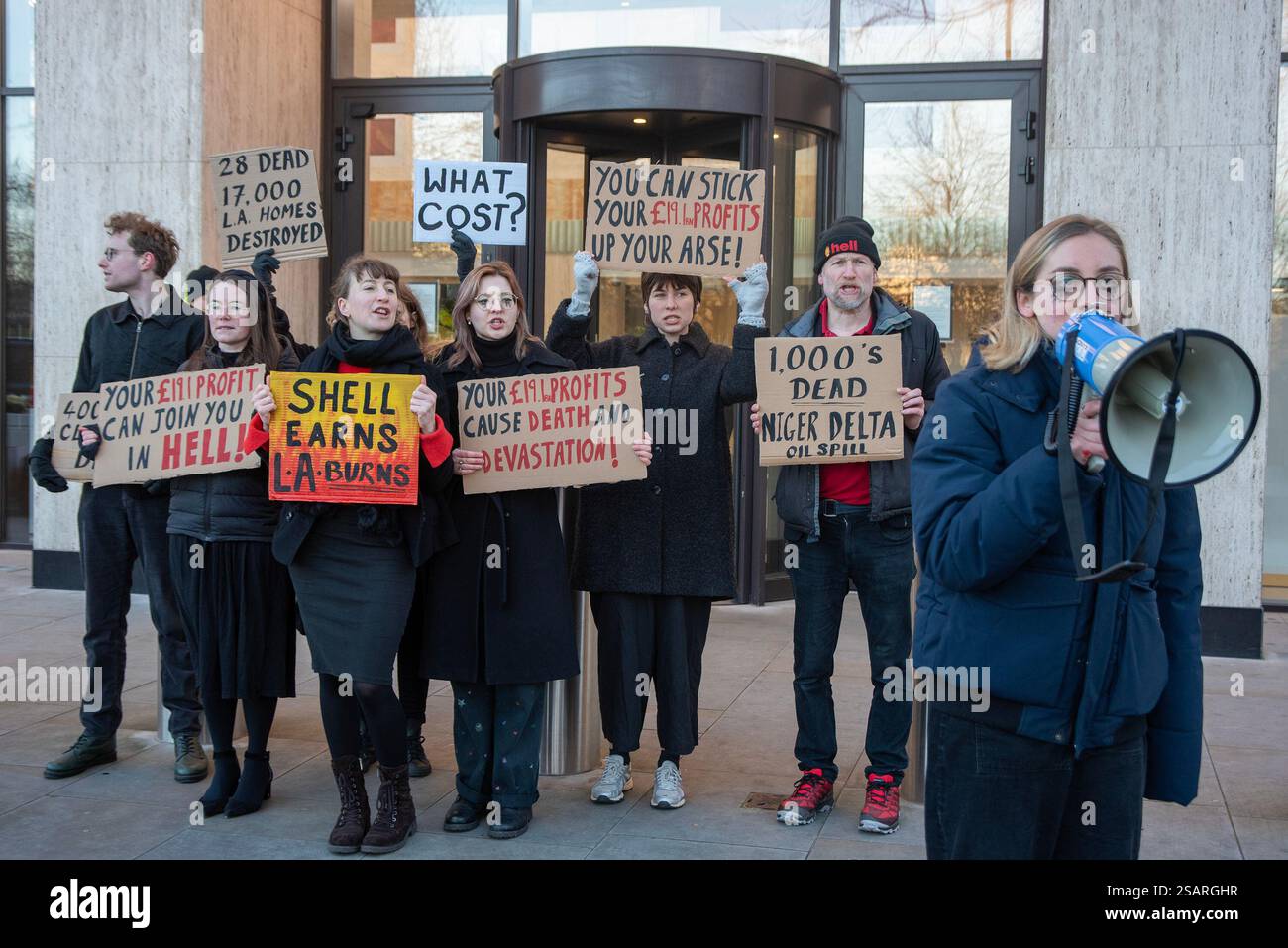 London, UK. 30th Jan, 2025. Activists hold placards expressing their ...