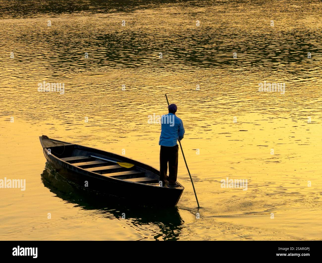 Sunset on the Narayani River which defines the boundary of the Chitwan ...