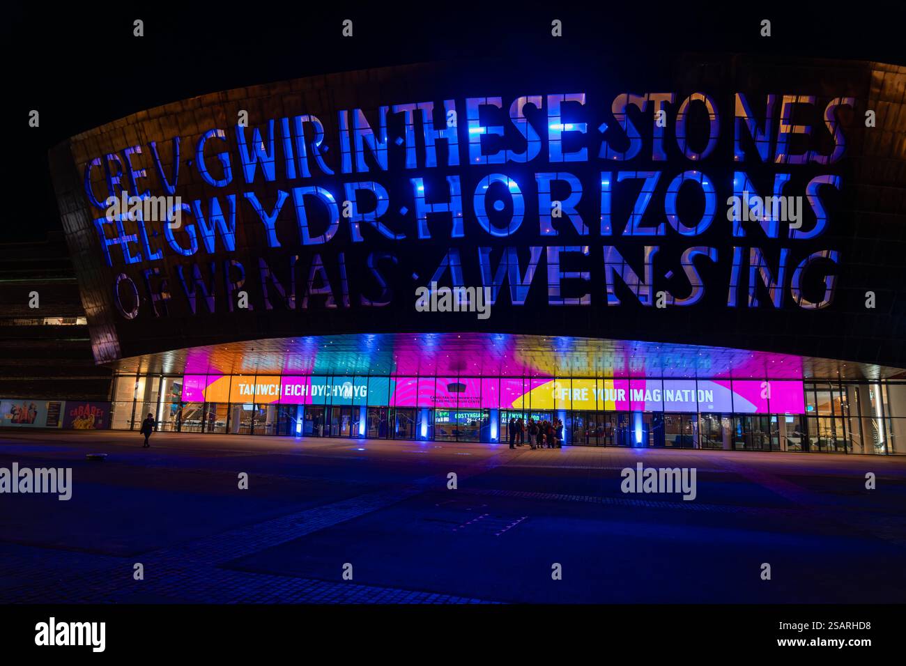 The Wales Millennium Centre illuminated with colorful lights at night ...