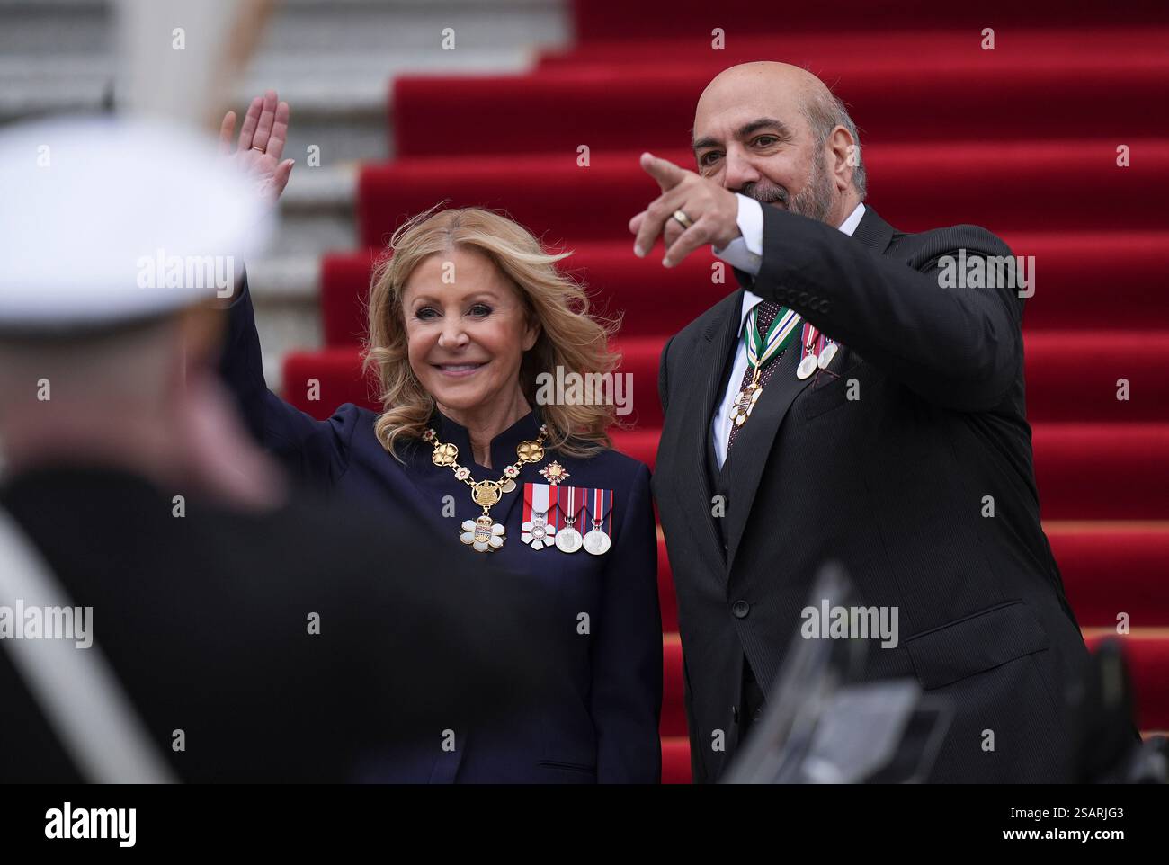 British Columbia Lt-Gov. Wendy Cocchia waves to a crown of onlookers as ...
