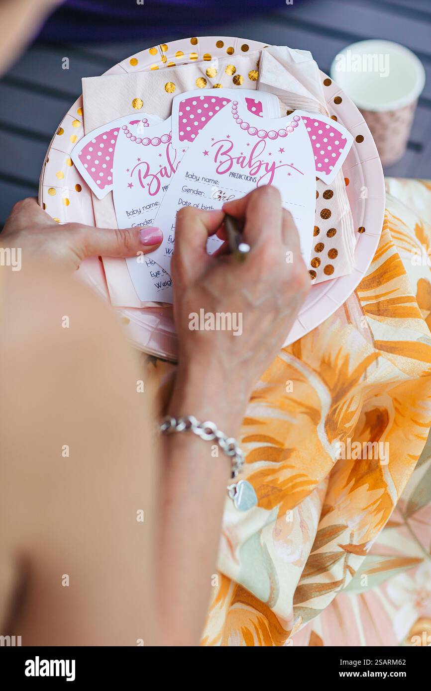 Baby shower wish card. Inscription on a postcard with the weight, name ...