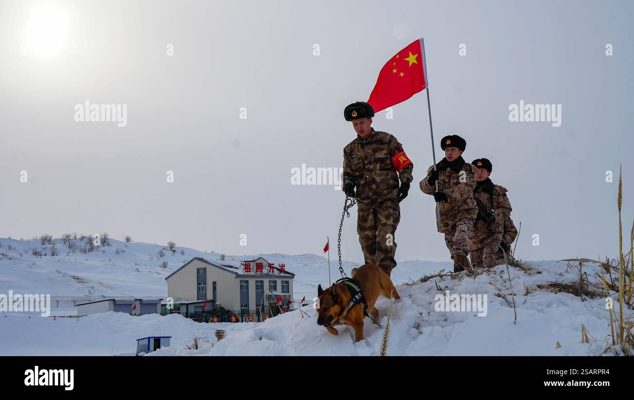 Beijing, China. 29th Jan, 2025. Soldiers patrol with a border guard ...