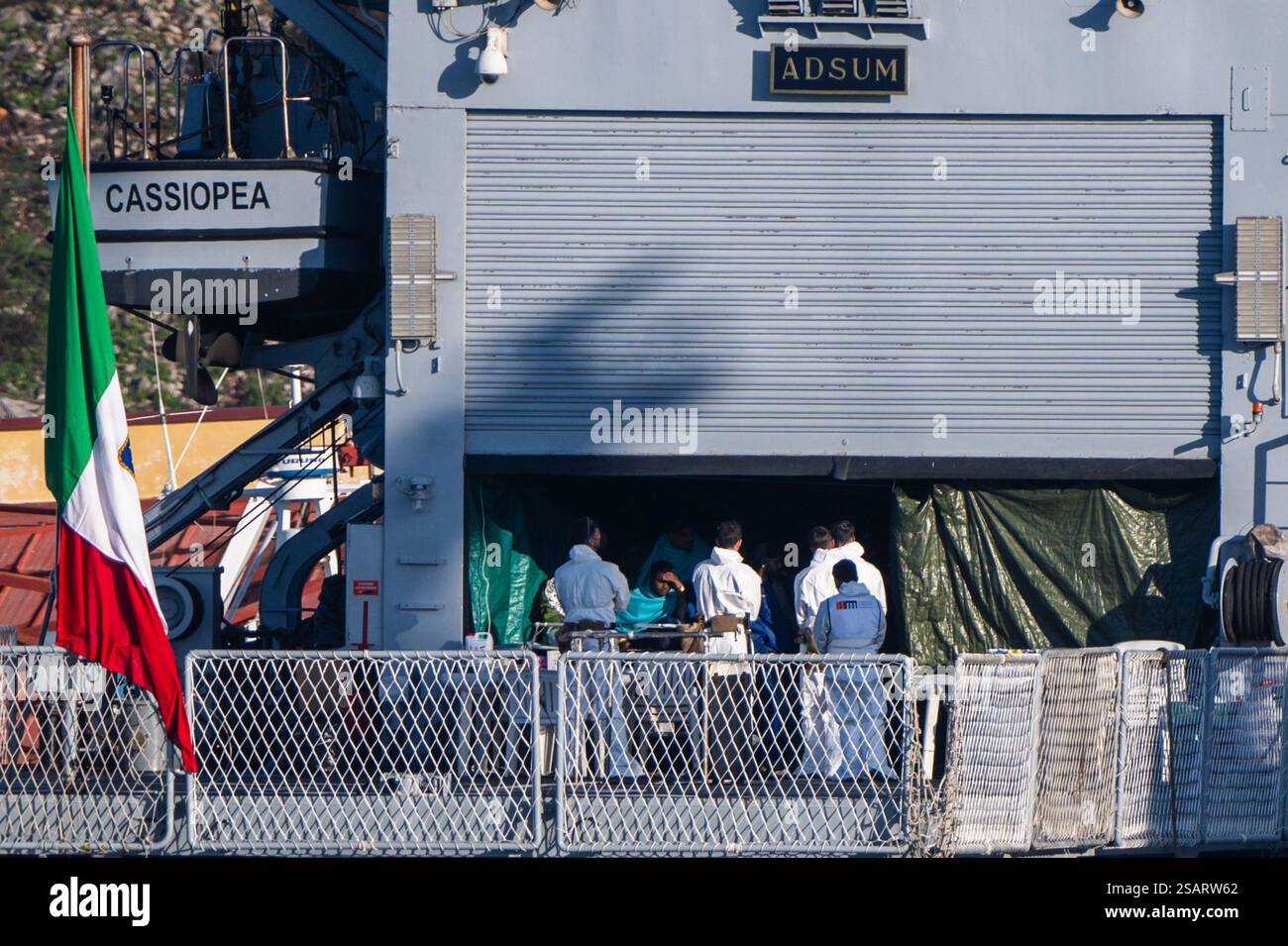 Shengjin, Albania. 28th Jan, 2025. A migrant an medical staff on the ...