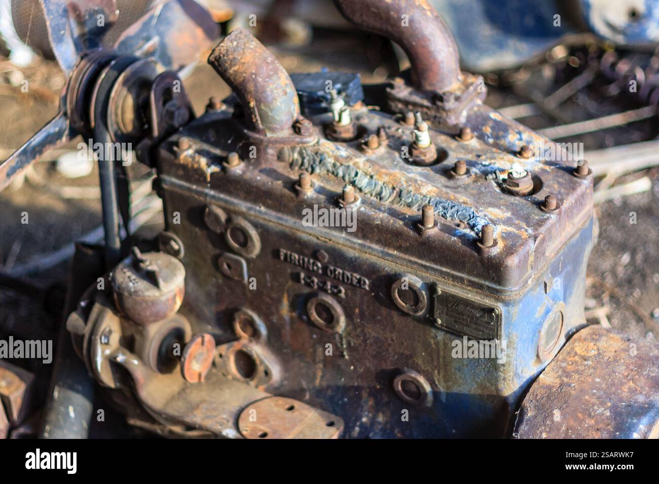 An old engine with a blue cover and a black and white label. The engine ...