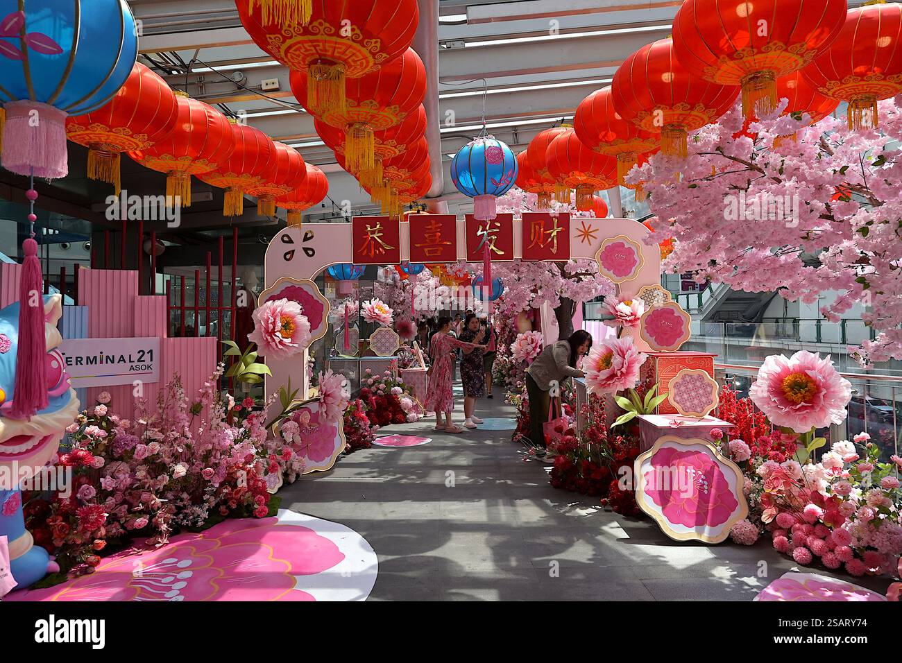 People enjoying the colorful display at a popular shopping mall in ...