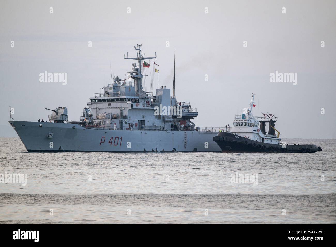 Shengjin, Albania. 28th Jan, 2025. A tug seen on the side of navy ship ...