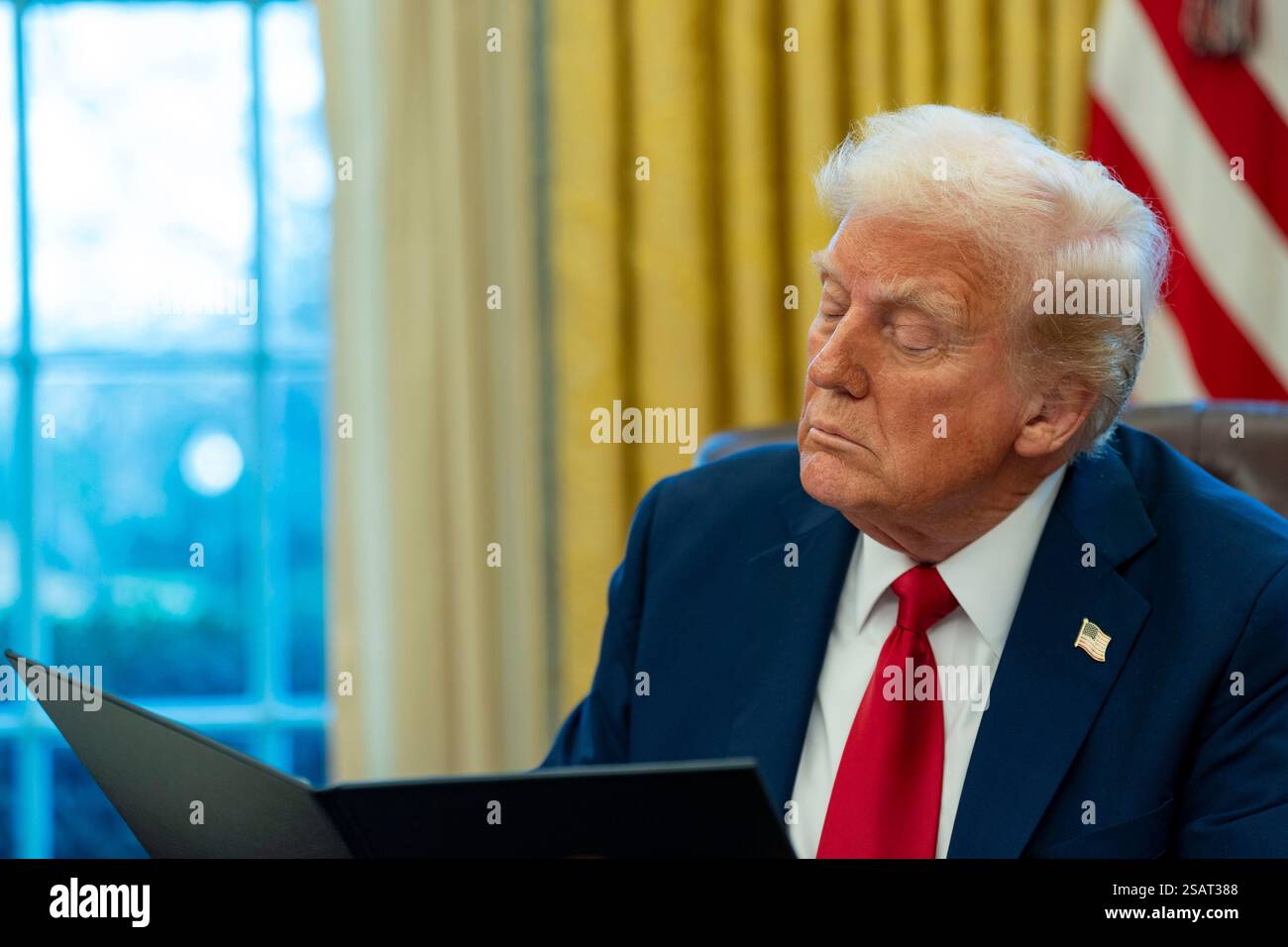 United States President Donald Trump signs two executive orders in the ...