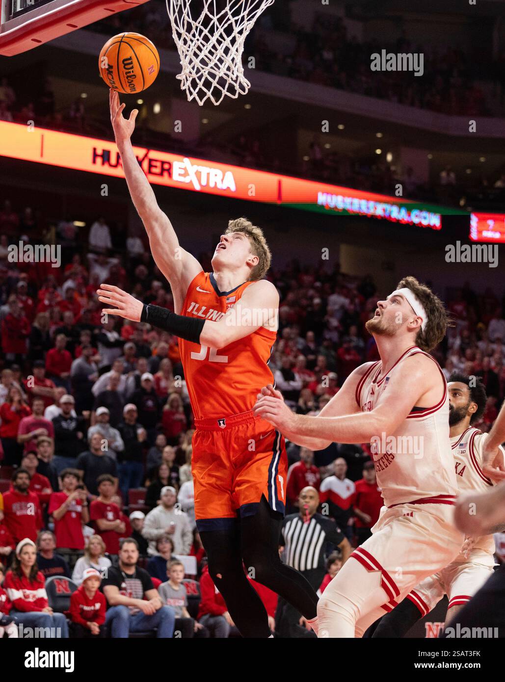 Illinois' Kasparas Jakucionis, left, shoots against Nebraska's Andrew ...