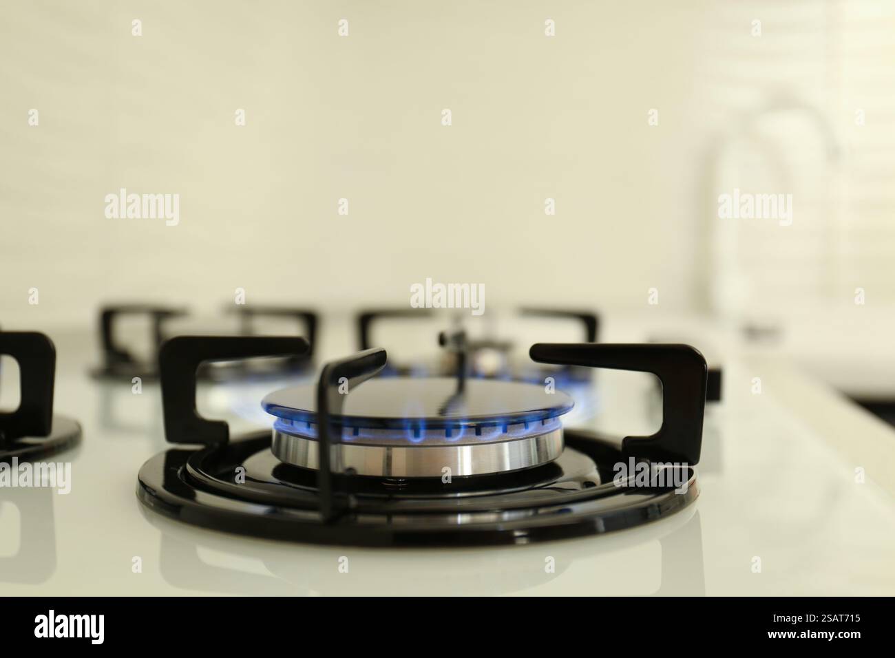 Gas burner of modern stove with burning blue flame, closeup Stock Photo ...