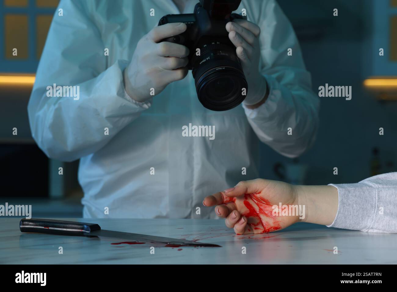 Forensic expert with camera, knife, blood and dead woman's body at ...
