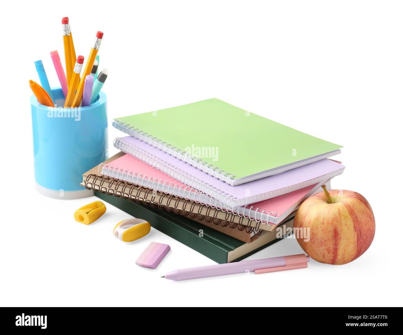 Doing homework. Notebooks, apple and stationery on white background ...