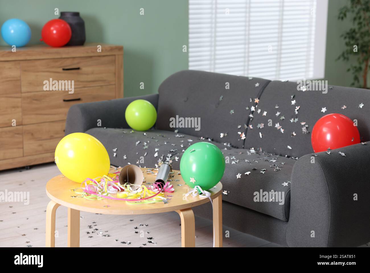 Shiny confetti, balloons and other party decor indoors Stock Photo - Alamy