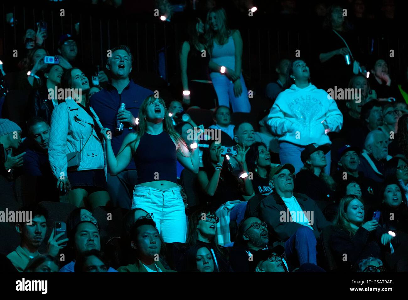 Audience members watch the FireAid benefit concert on Thursday, Jan. 30, 2025, at The Forum in ...