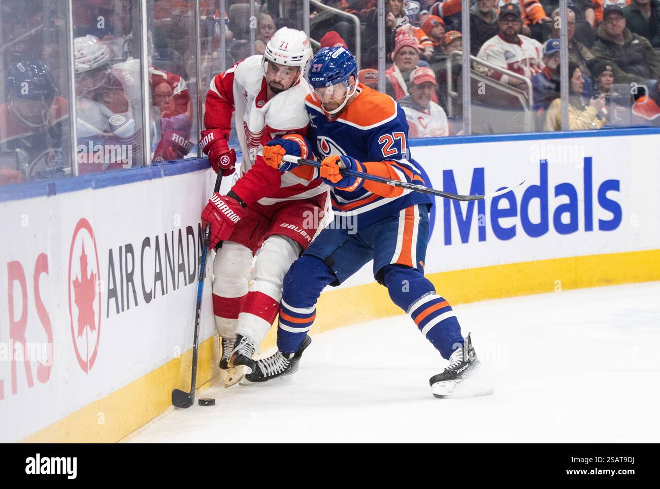 Detroit Red Wings' Dylan Larkin (71) and Edmonton Oilers' Brett Kulak ...