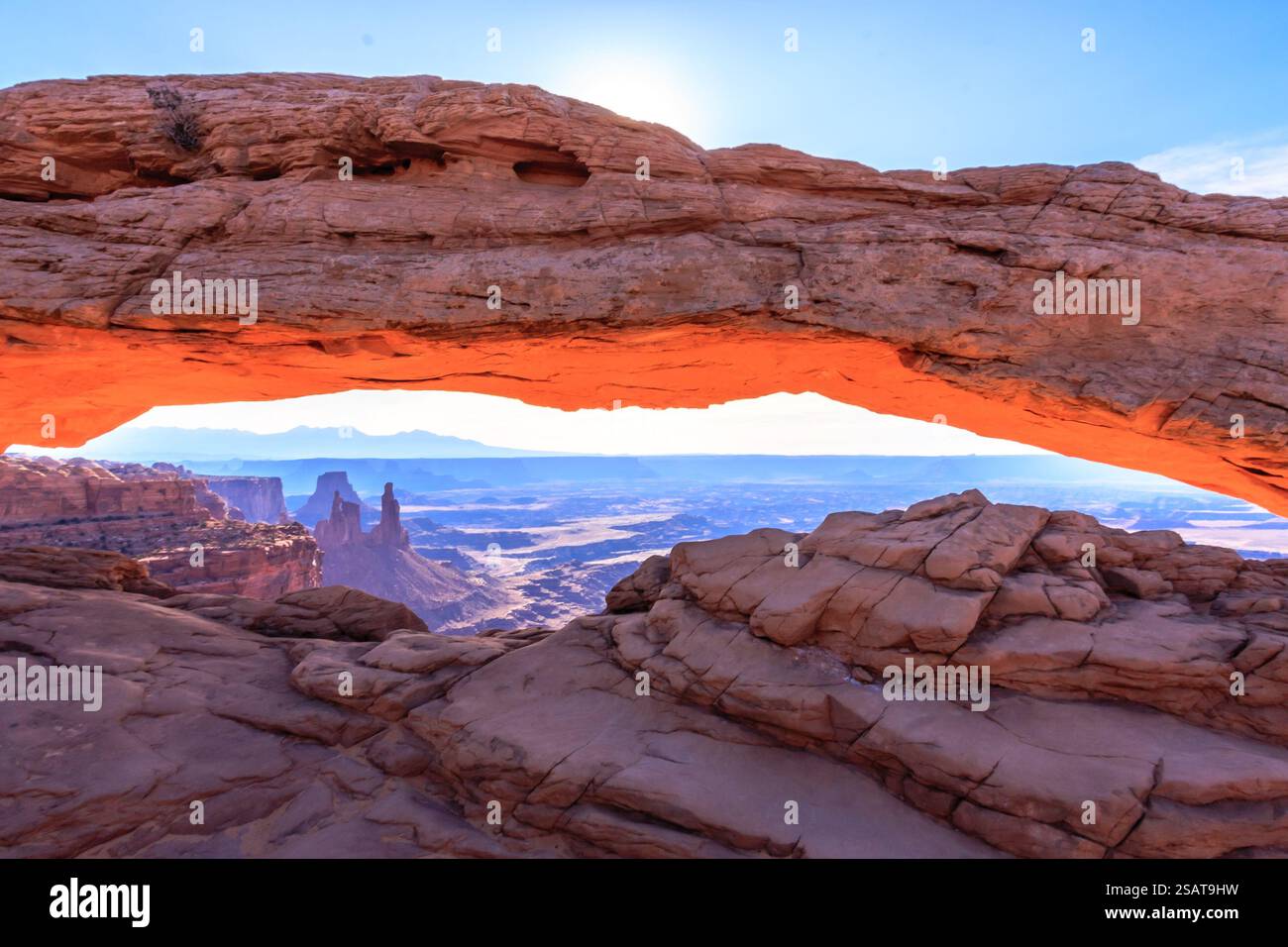 Mesa Arch spans 90 feet and stands at the edge of a mesa precipice ...