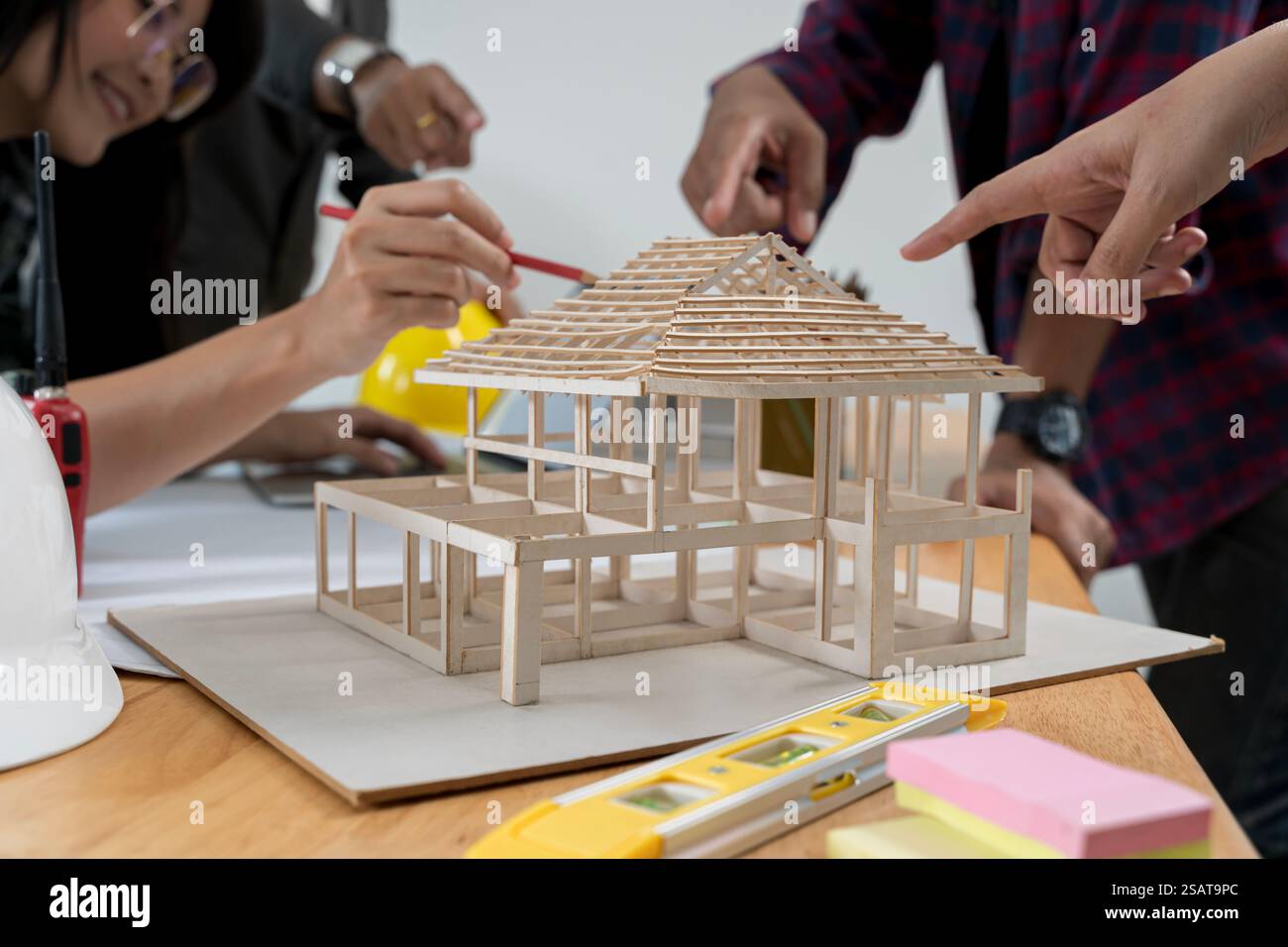 Group of an architect working and discussing about an architecture ...