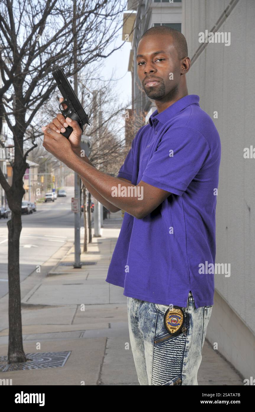 Police detective man on the job with a gun Stock Photo - Alamy