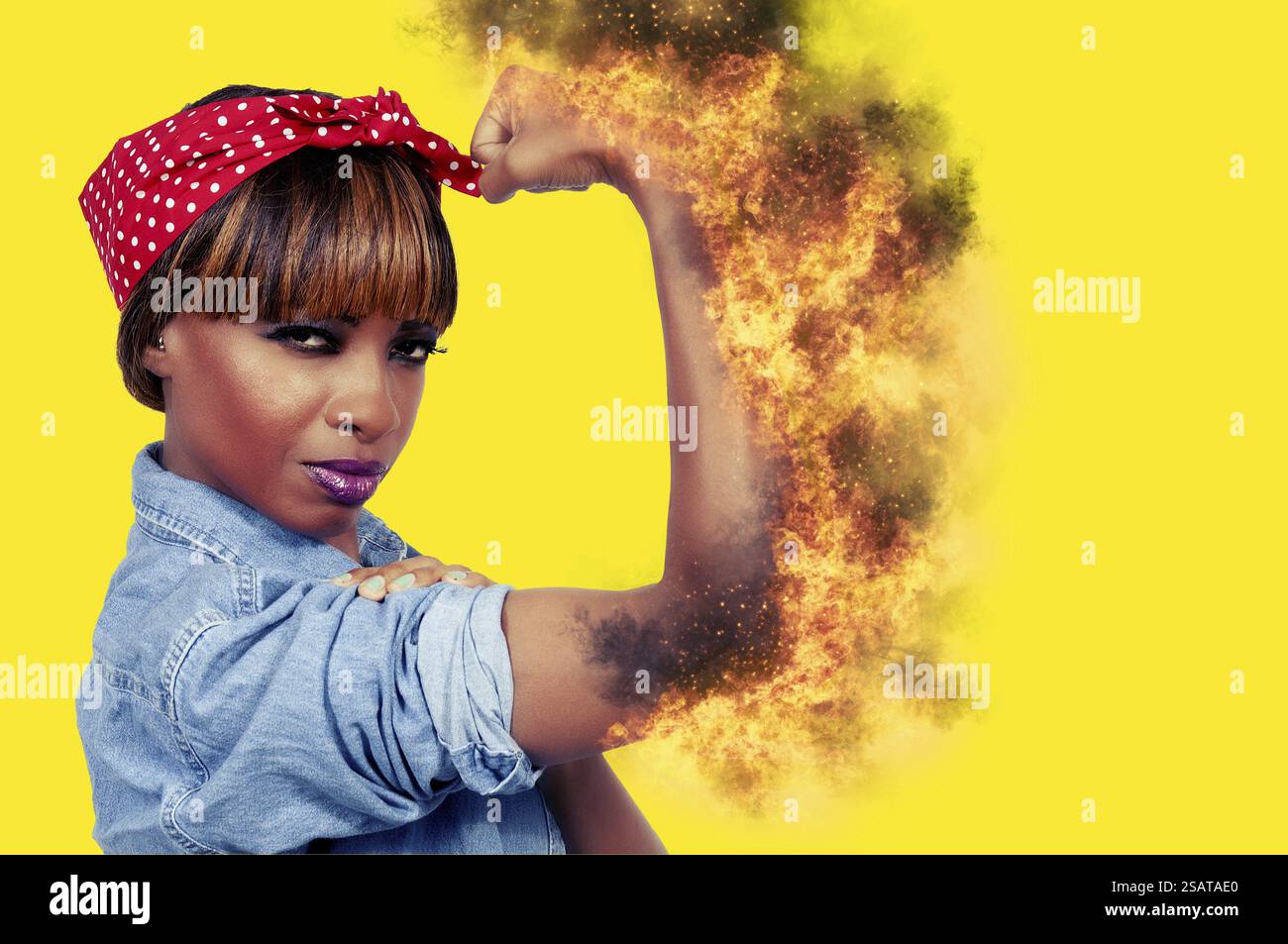 Beautiful woman dressed as the iconic Rosie the Riveter Stock Photo - Alamy