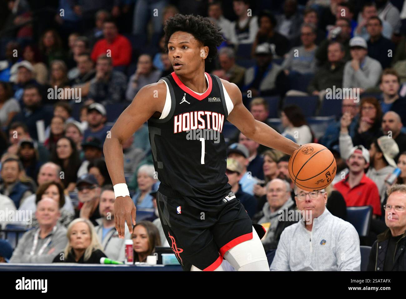Houston Rockets forward Amen Thompson (1) handles the ball in the first ...
