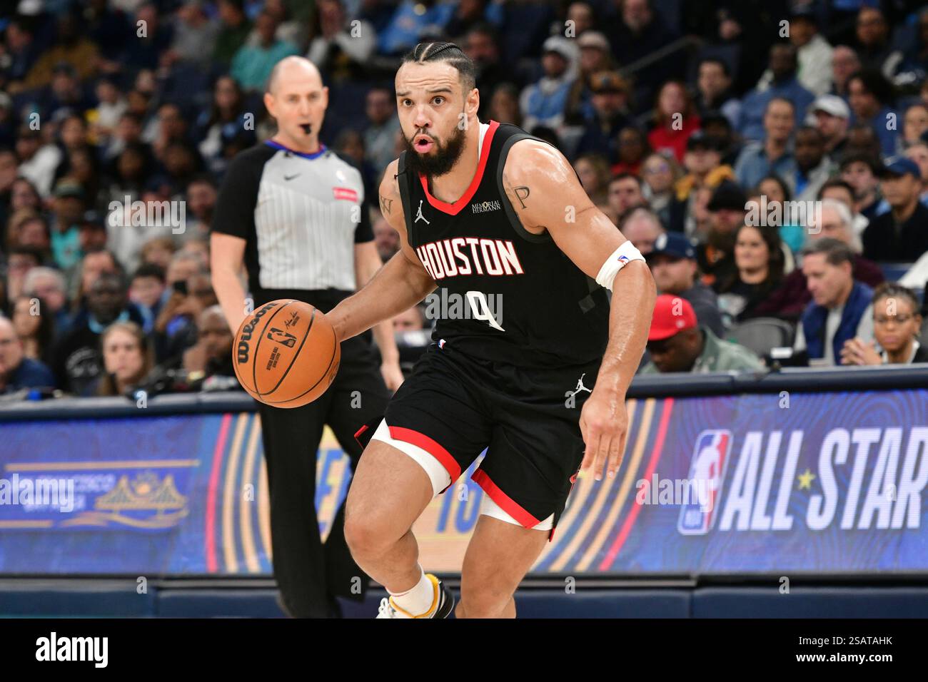 Houston Rockets forward Dillon Brooks (9) handles the ball in the first ...