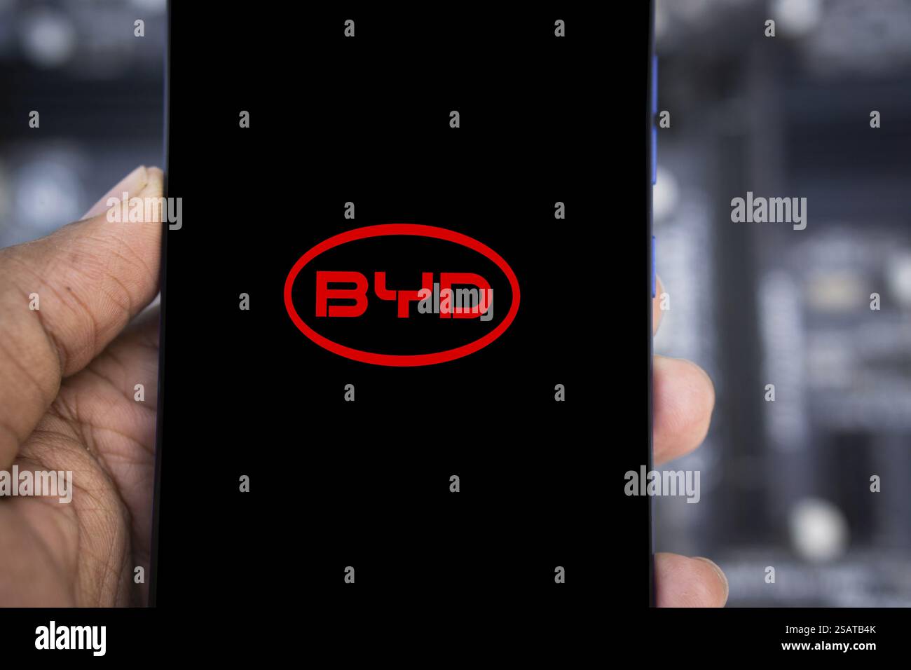 Mobile phone with business logo of Chinese car manufacturer BYD Co. Ltd ...
