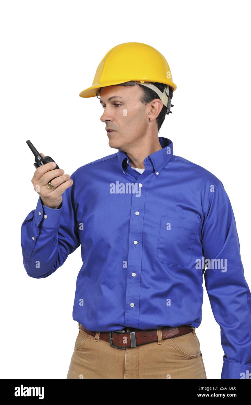 Handsome man construction worker talking on a walkie talkie Stock Photo ...