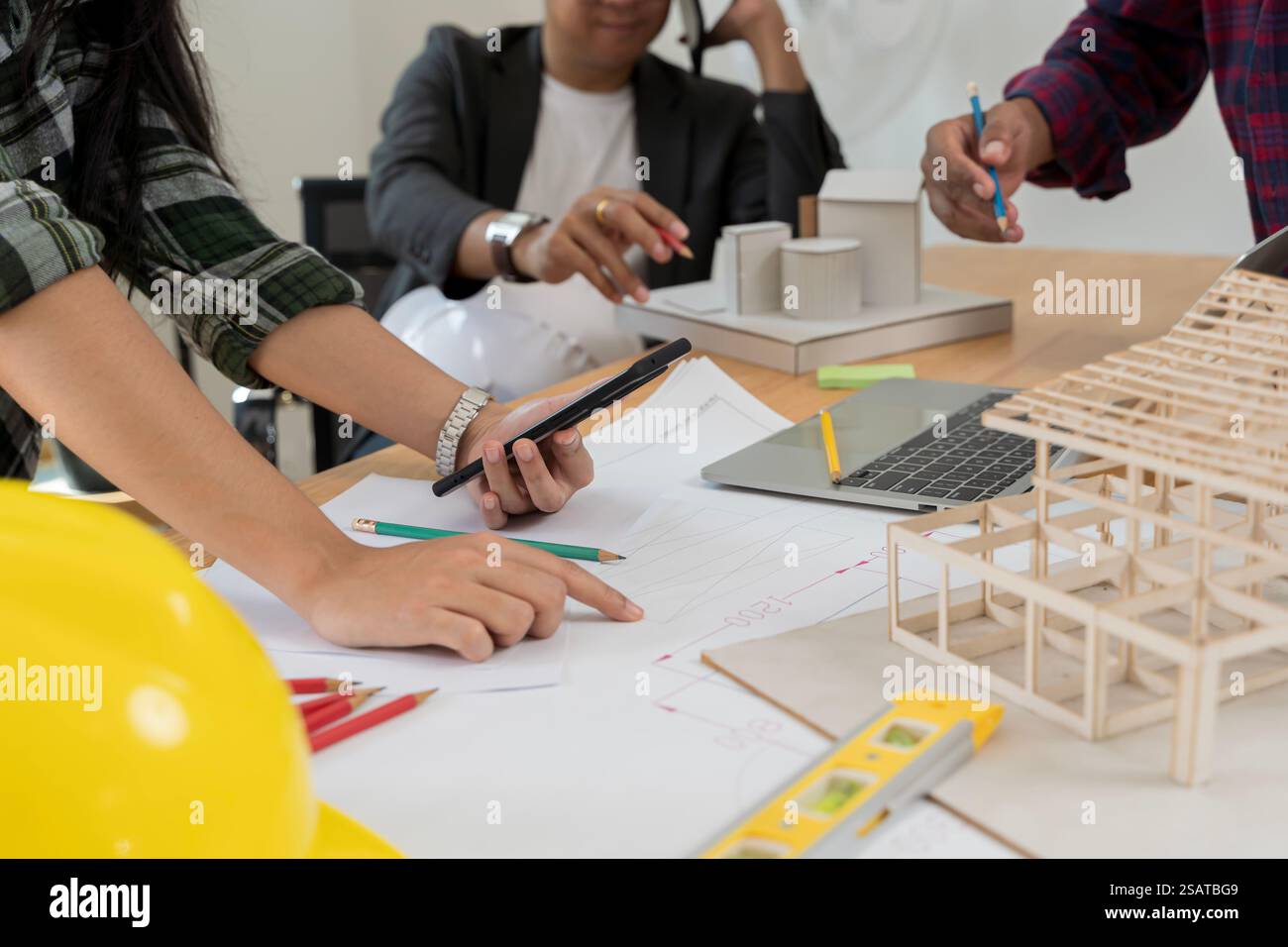 Architect explaining project plan to clients. Data working and tablet ...