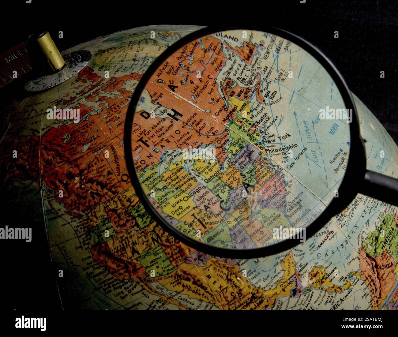 Globe under magnifying glass hi-res stock photography and images - Alamy