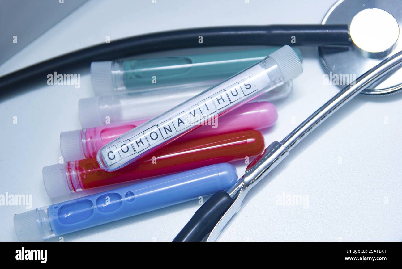Test tubes labeled coronavirus next to a stethoscope on a table Stock ...