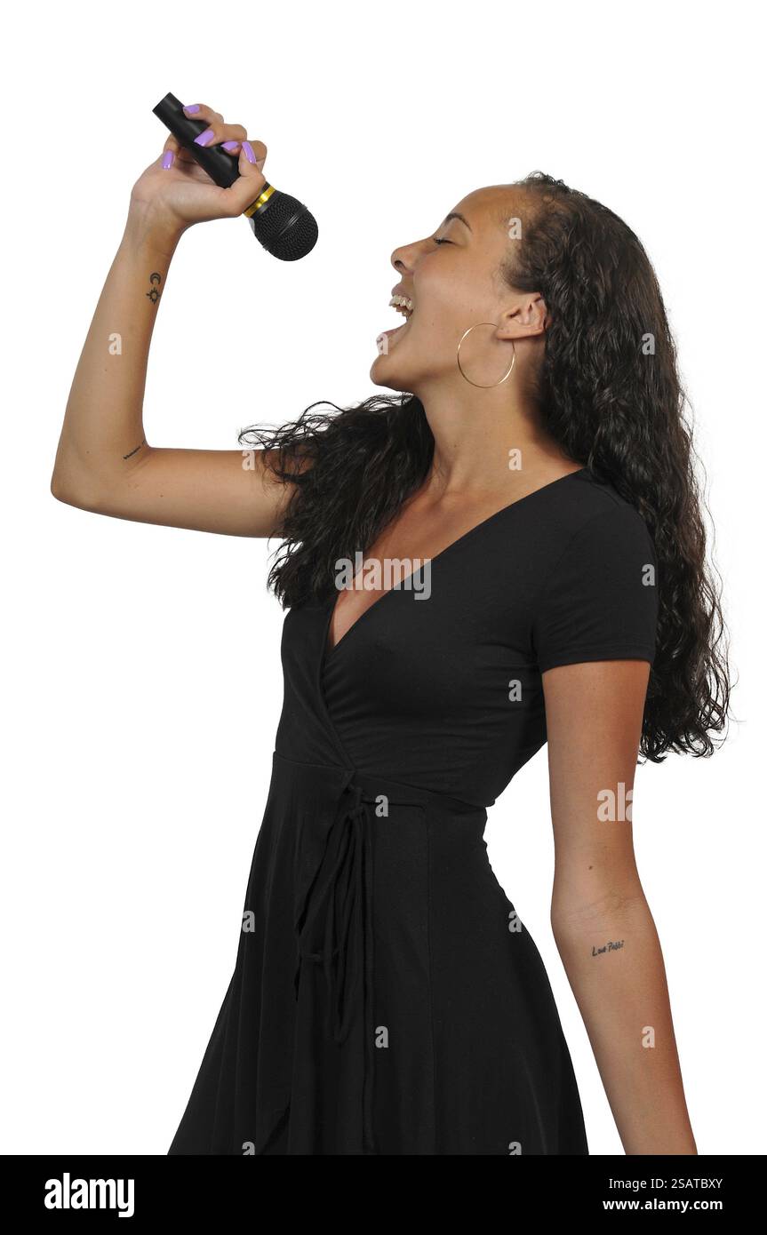 Beautiful woman singer performing at a concert Stock Photo - Alamy
