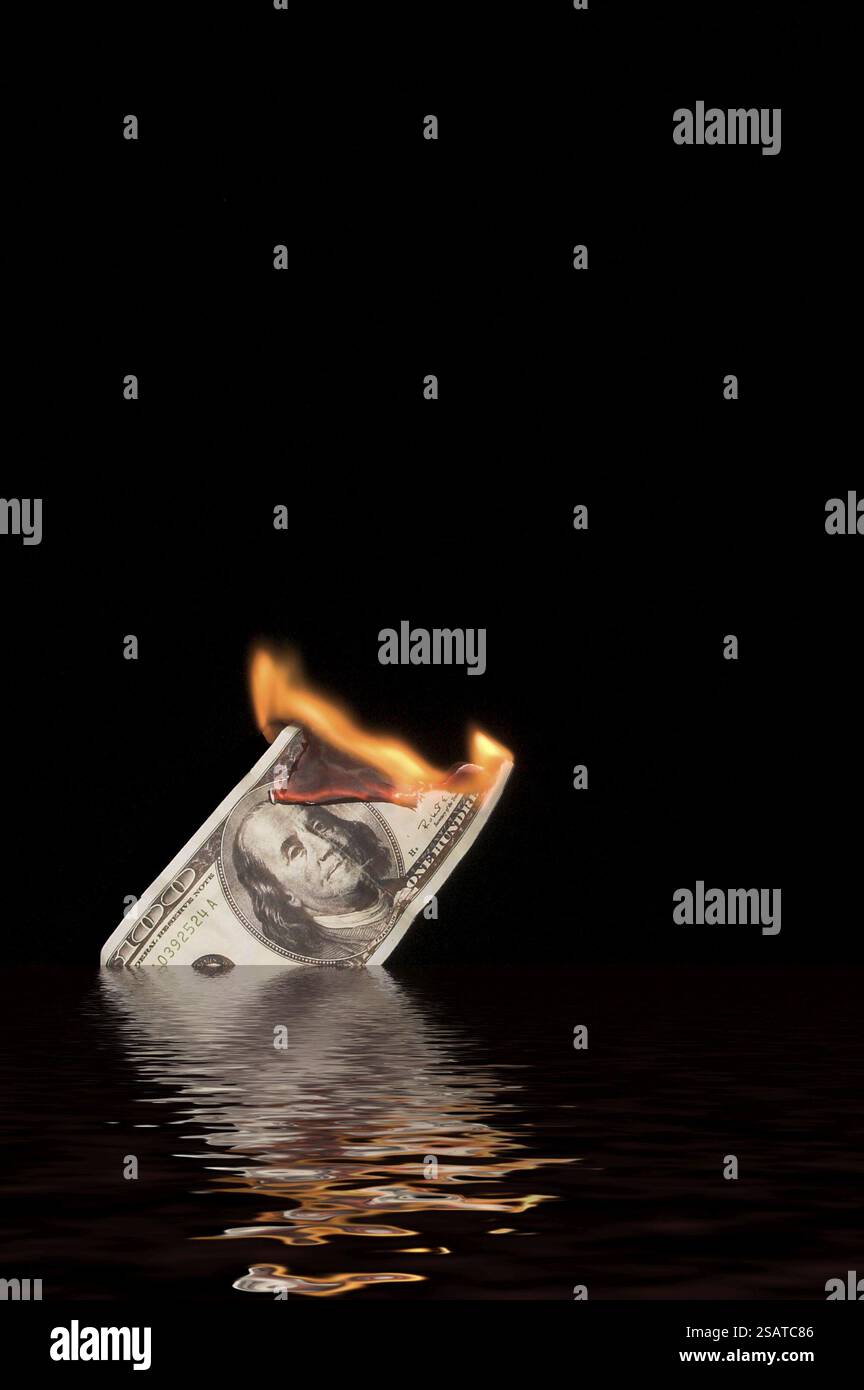 A one hundred dollar bill on fire as it sinks Stock Photo - Alamy